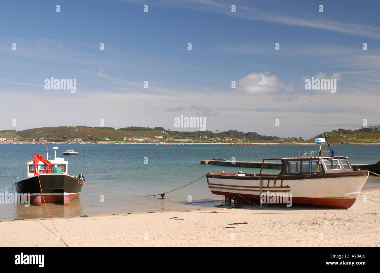 Boats on the beach at Bryher with Tresco across the water Bryher Isles ...