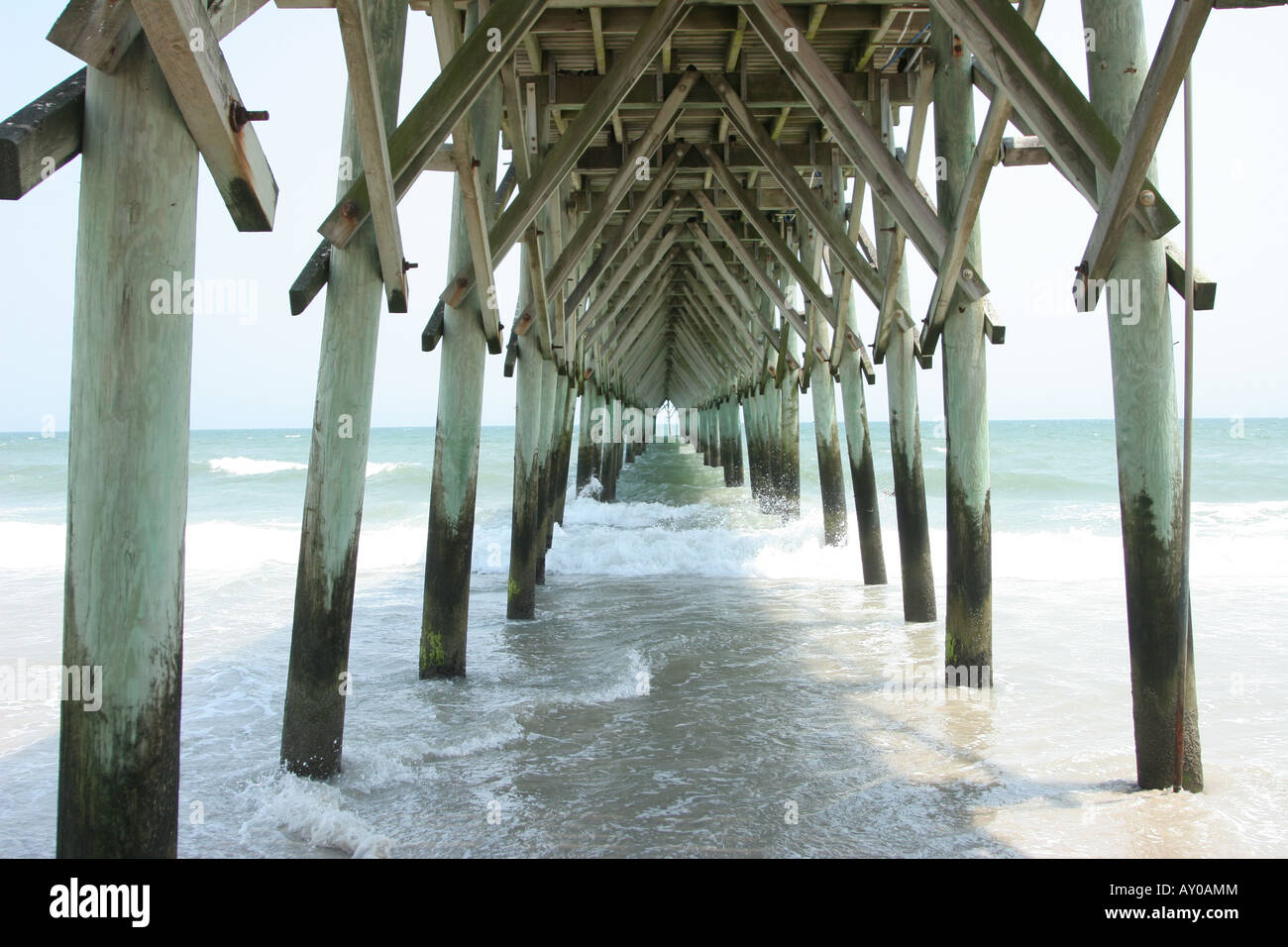 surf under a pier Stock Photo - Alamy