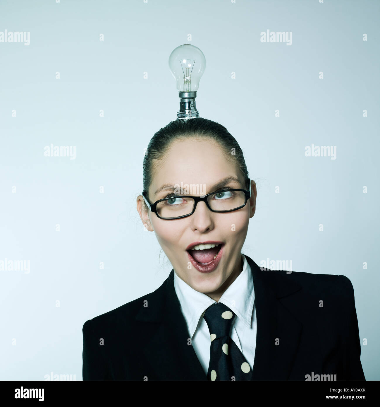 studio shot portrait of a beautiful young woman in a costume suit ...