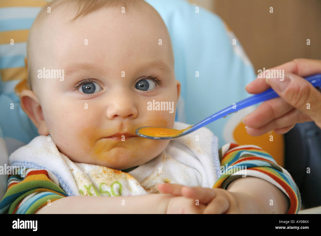 Portrait of eating baby Stock Photo - Alamy
