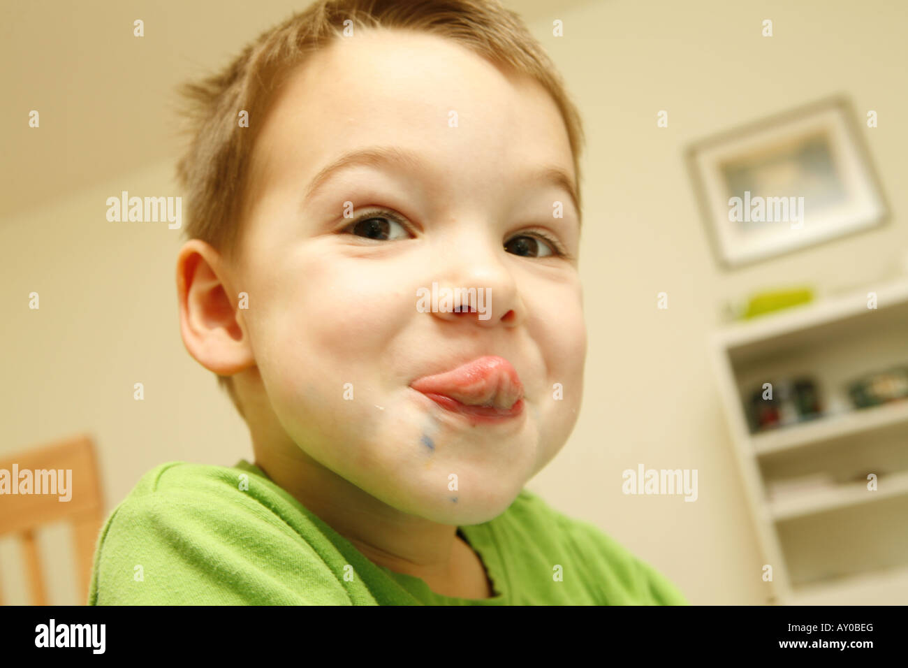 Boy is doing grimace Stock Photo - Alamy