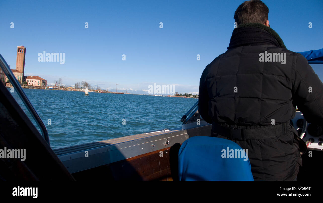 Man riding in motorboat Stock Photo - Alamy