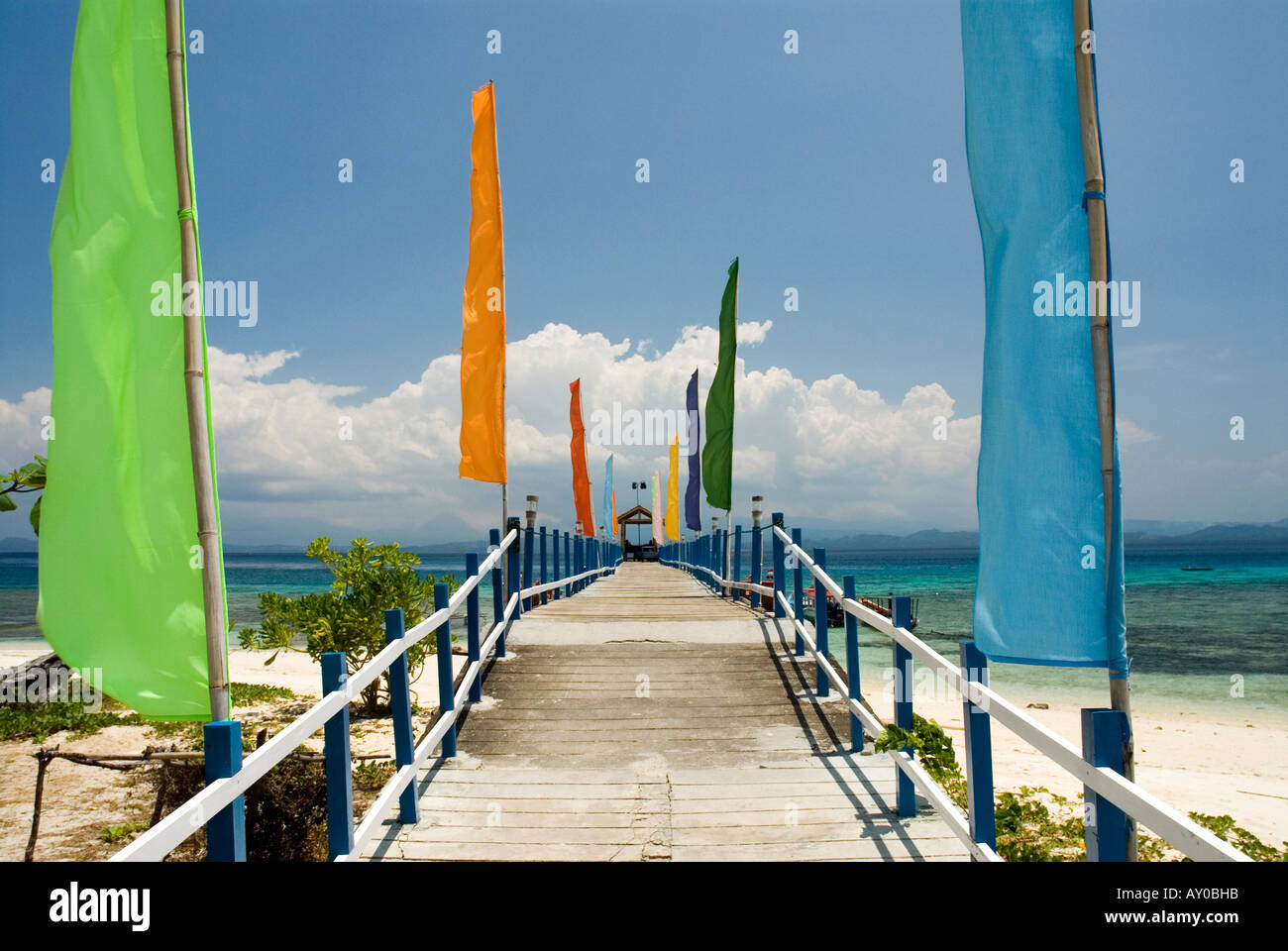 Jetty with colourful banners at Gangga Island dive resort near Manado ...