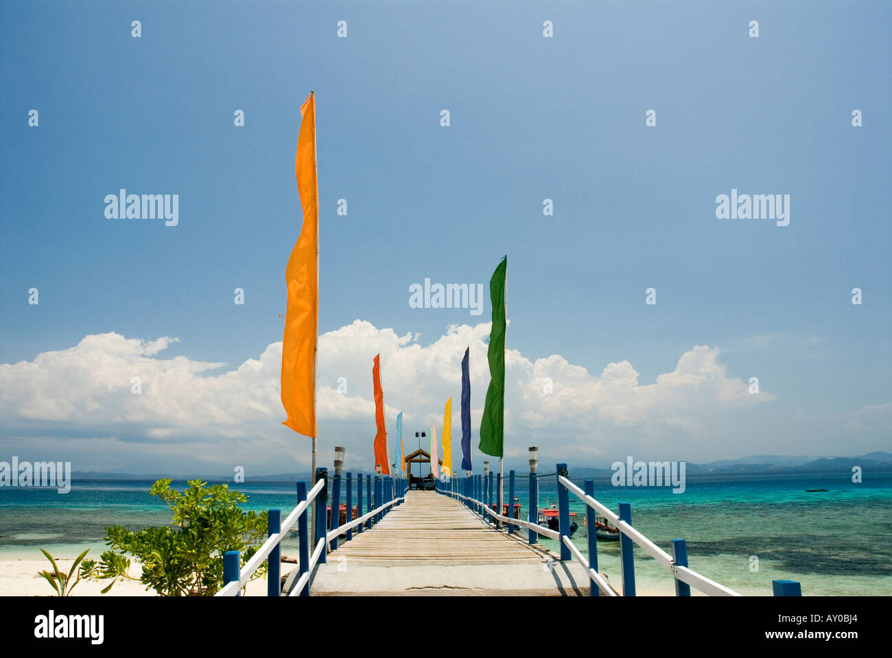 Jetty with colourful banners at Gangga Island dive resort near Manado ...