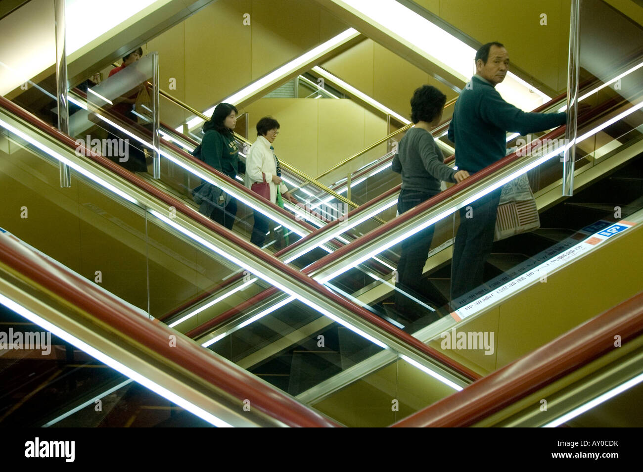 Shoppers on department store escalators hi-res stock photography and ...