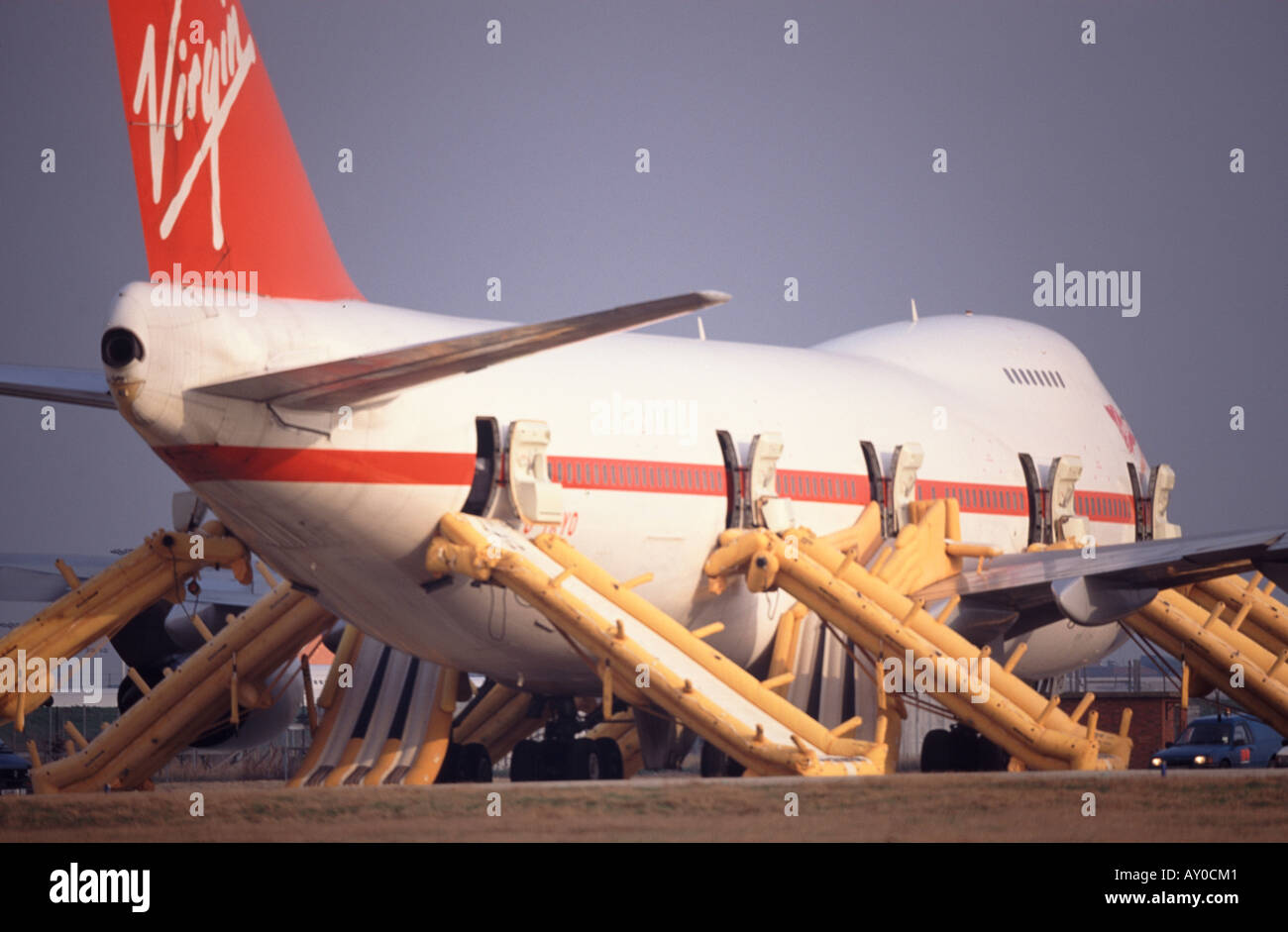 Aircraft jet jets red yellow unusual emergency chutes inflated chutes ...