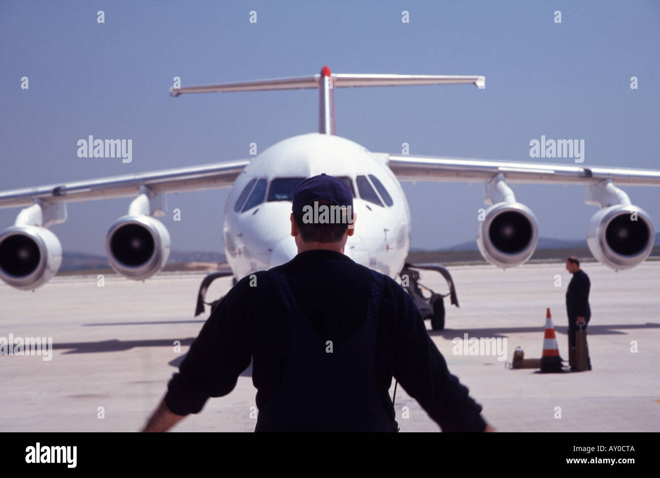 airport marshaller directing aircraft into parking position at Sabiha ...