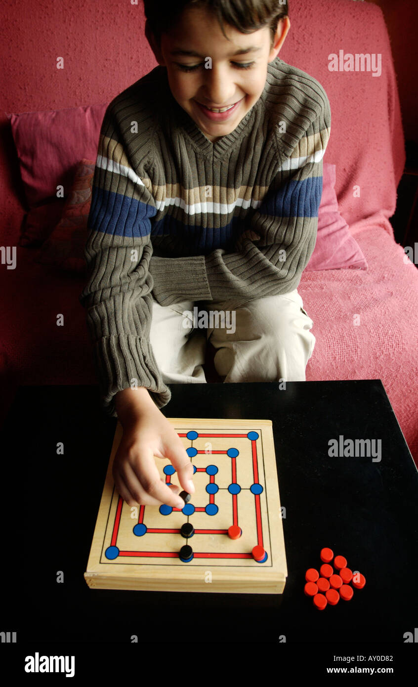 young boy playing game Stock Photo - Alamy