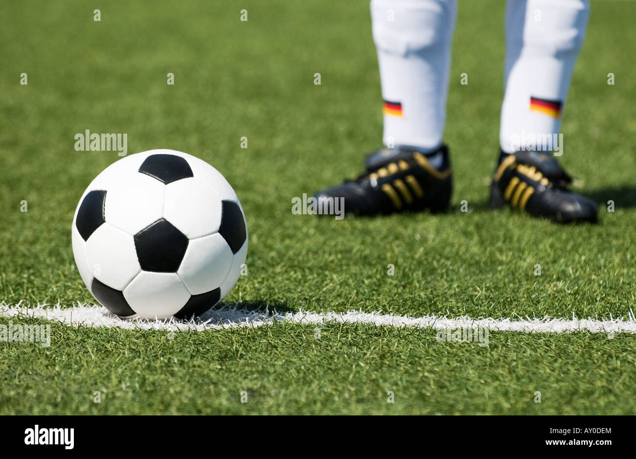 the feet of a german national football player and a vintage black and ...