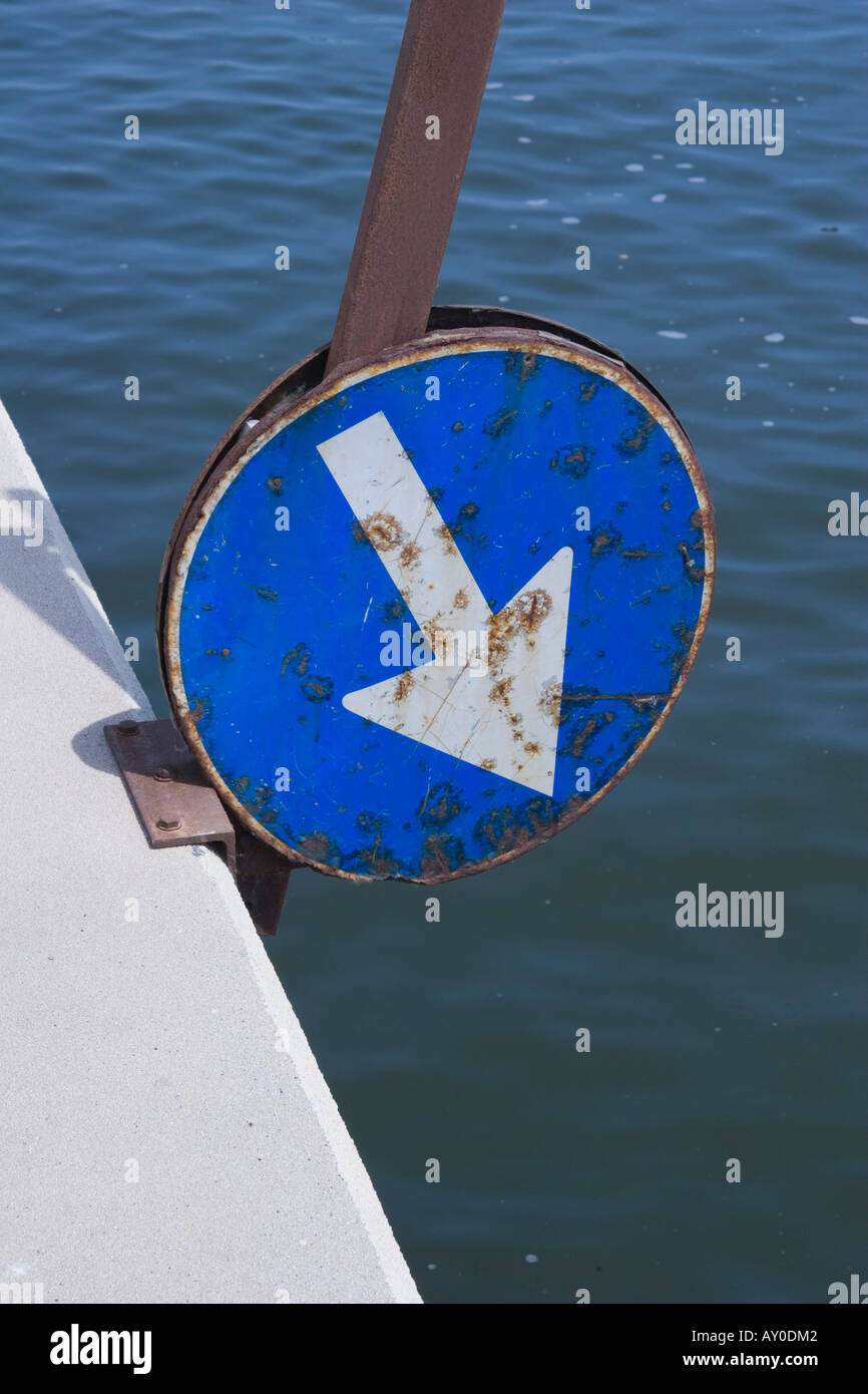 sign, signal, arrow, round, blue, white, pole, rust, sea, water, harbor ...