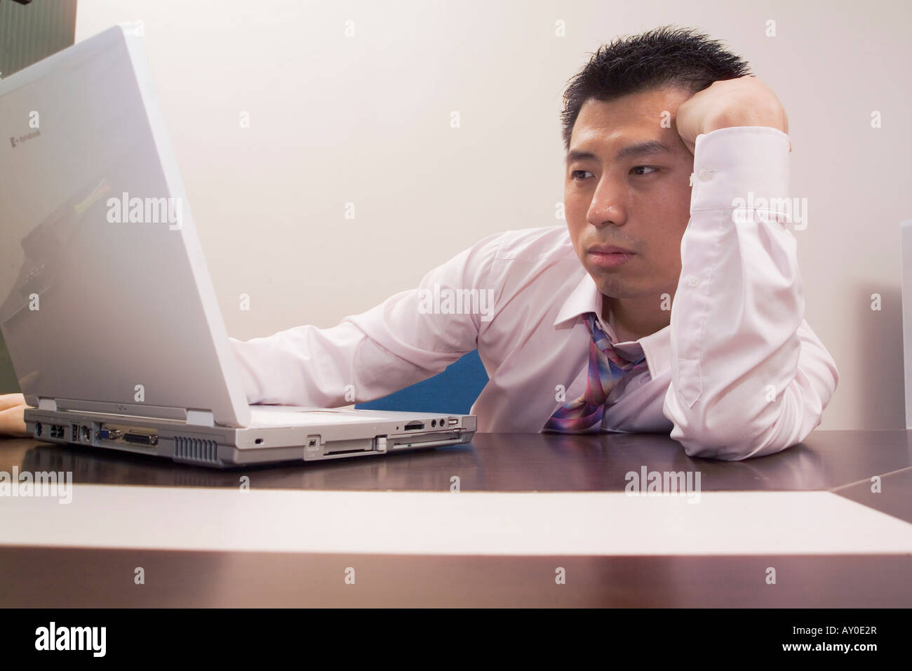 a man is setting and look at tired Stock Photo - Alamy