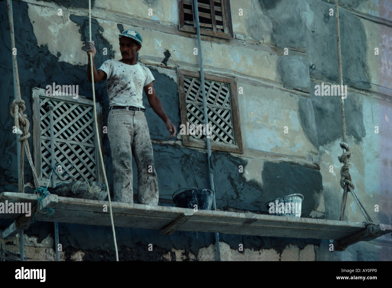 saudi builder on construction site renovating old saudi traditional ...