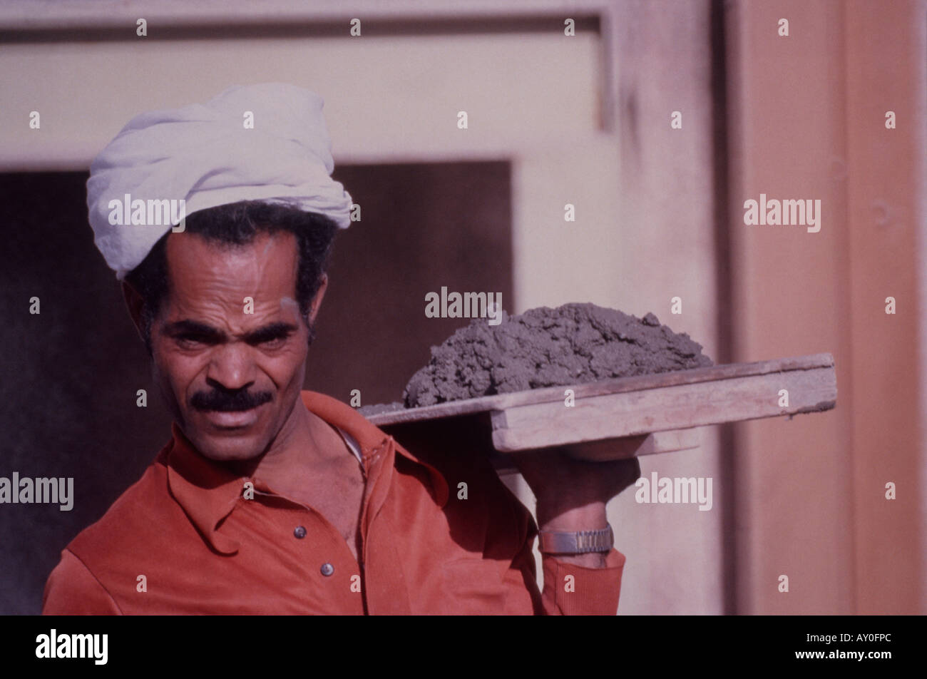 saudi builder worker holding a hod of cement in jeddah saudi arabia ...