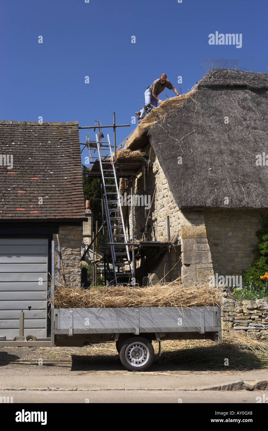 Man Thatching a Roof, Cotswolds, England, UK Stock Photo - Alamy