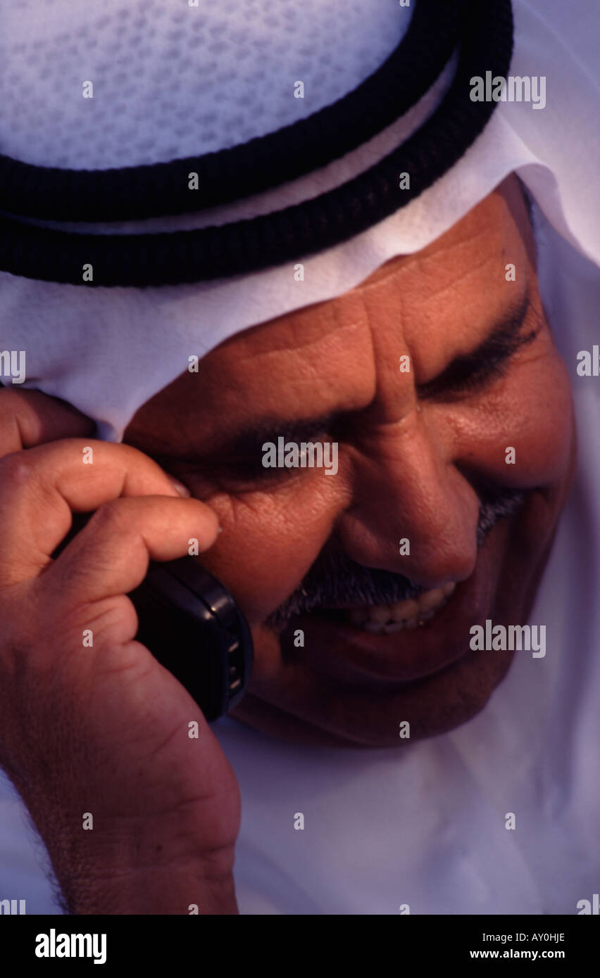 Arab man making mobile telephone phone call in the united arab emirates ...