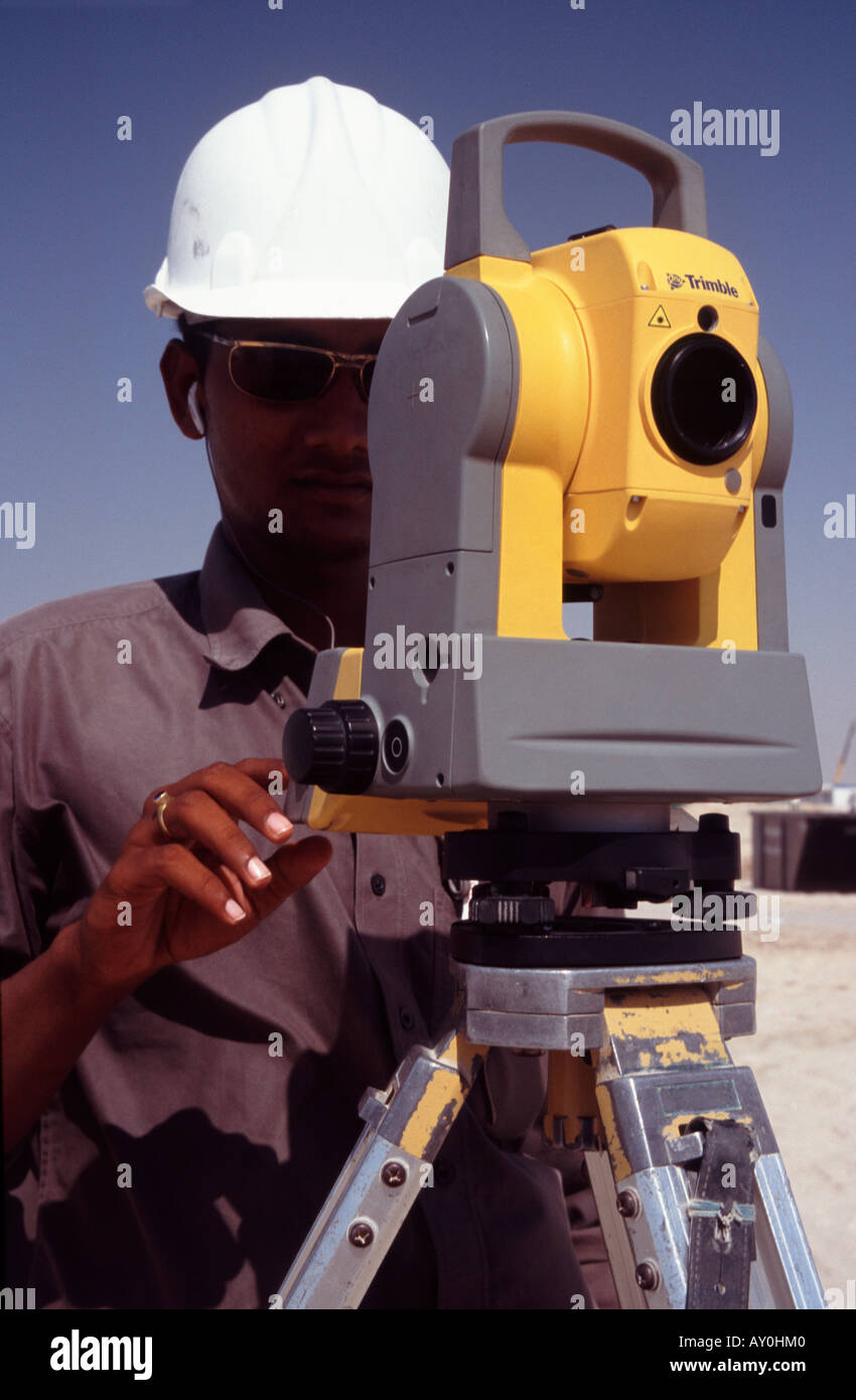 indian construction working taking elevation measurements in the united ...