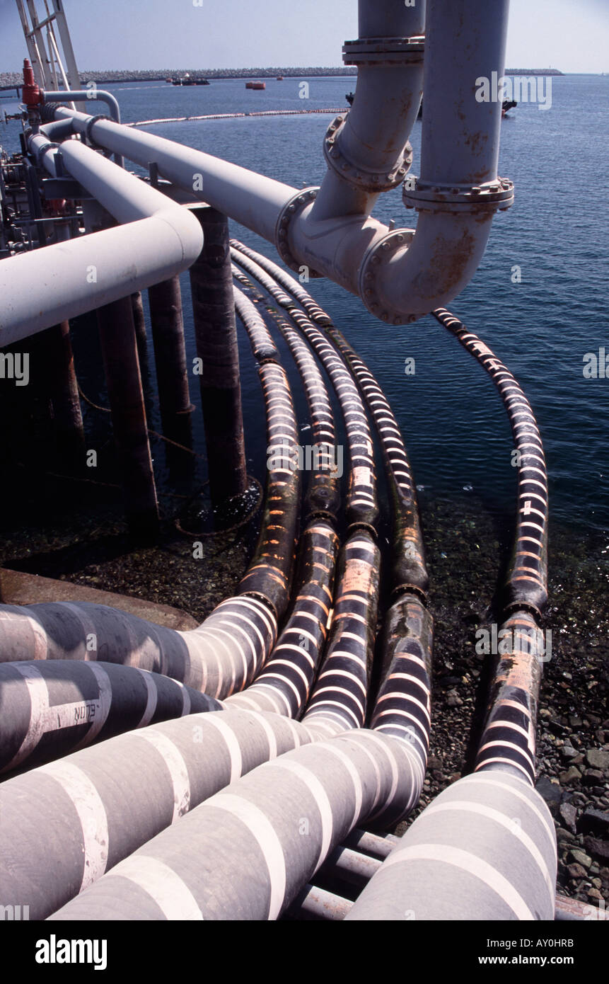 petrochemical pipes leading from off shore tanker at berth in the ...