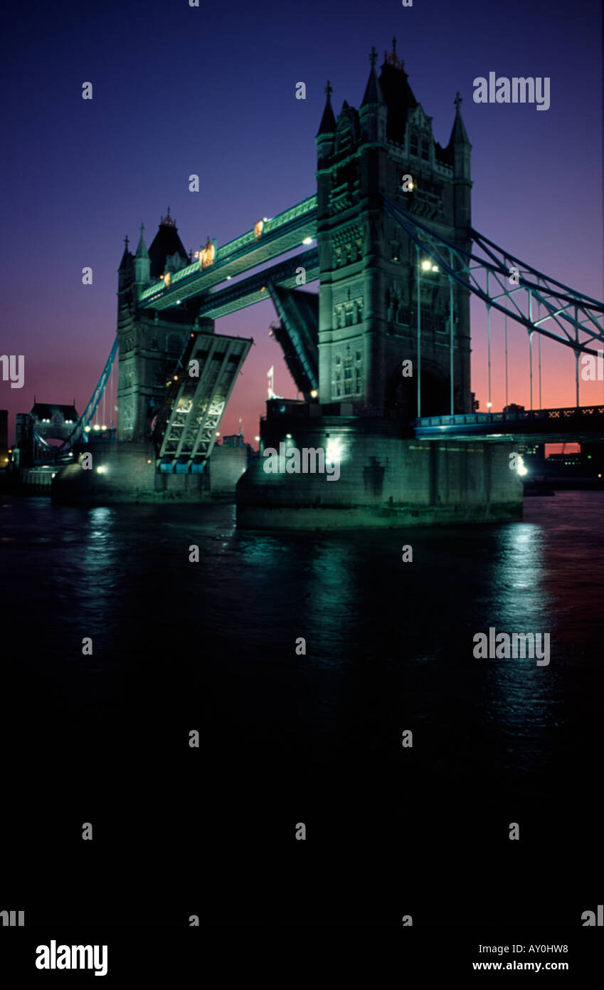 Tower Bridge with bridges raised at dusk in London England uk Stock ...