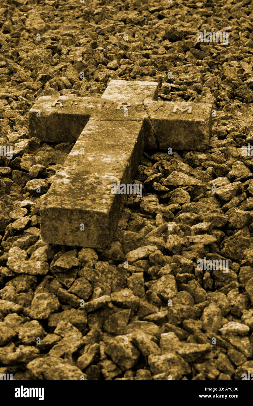 Stone cross on ground Stock Photo - Alamy