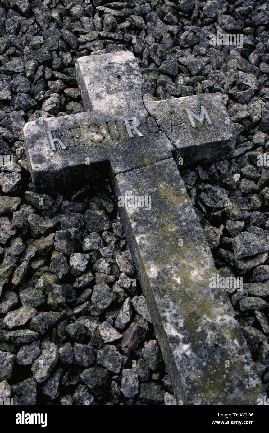 Old stone cross on ground Stock Photo - Alamy