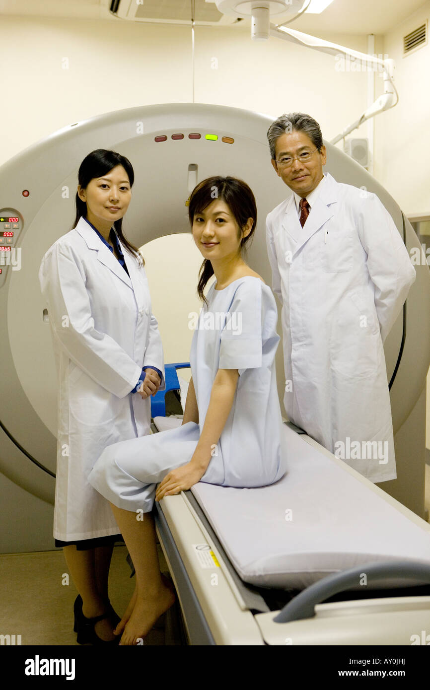 Young woman sitting on CAT Scan Stock Photo - Alamy