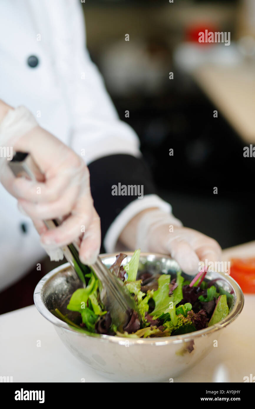 Chef mixing fresh vegetable salad hi-res stock photography and images ...