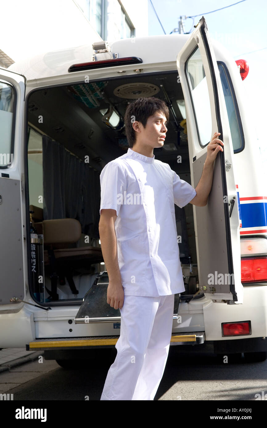 Nurse opening door of ambulance Stock Photo - Alamy