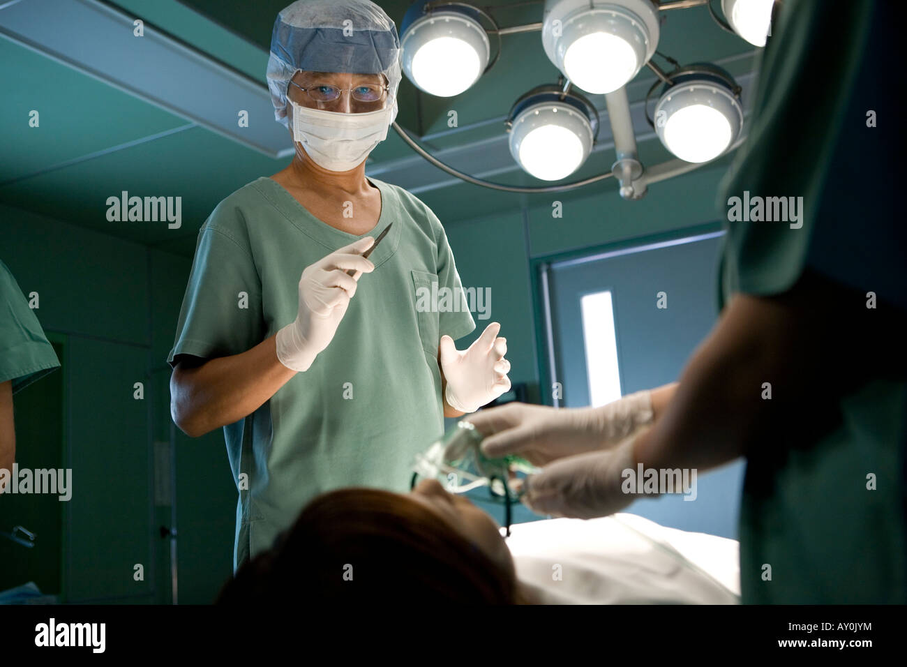 Doctor holding scalpel Stock Photo - Alamy