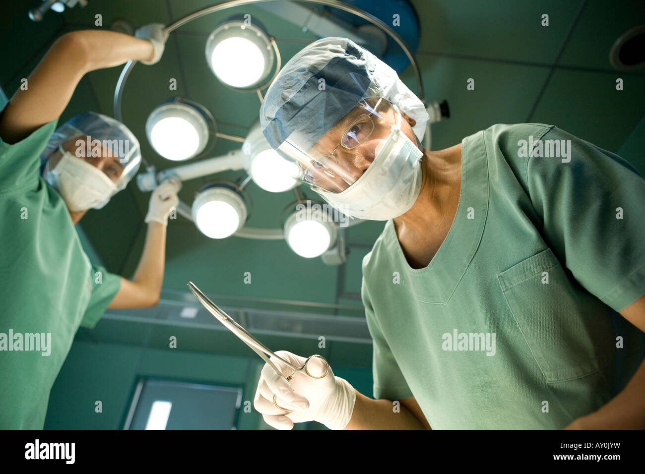 Doctor holding clamp Stock Photo - Alamy