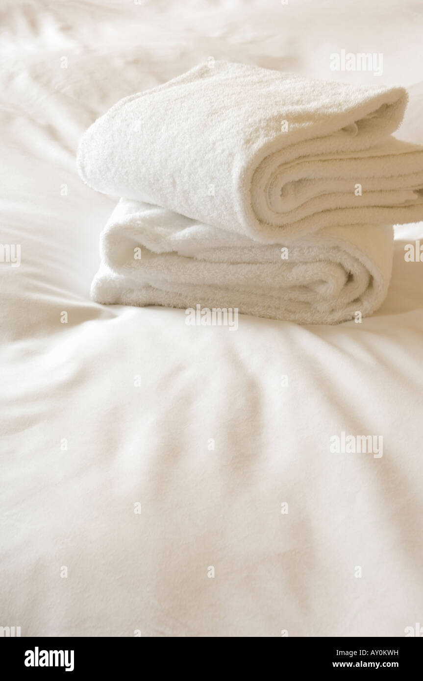 Towels on bed Stock Photo - Alamy