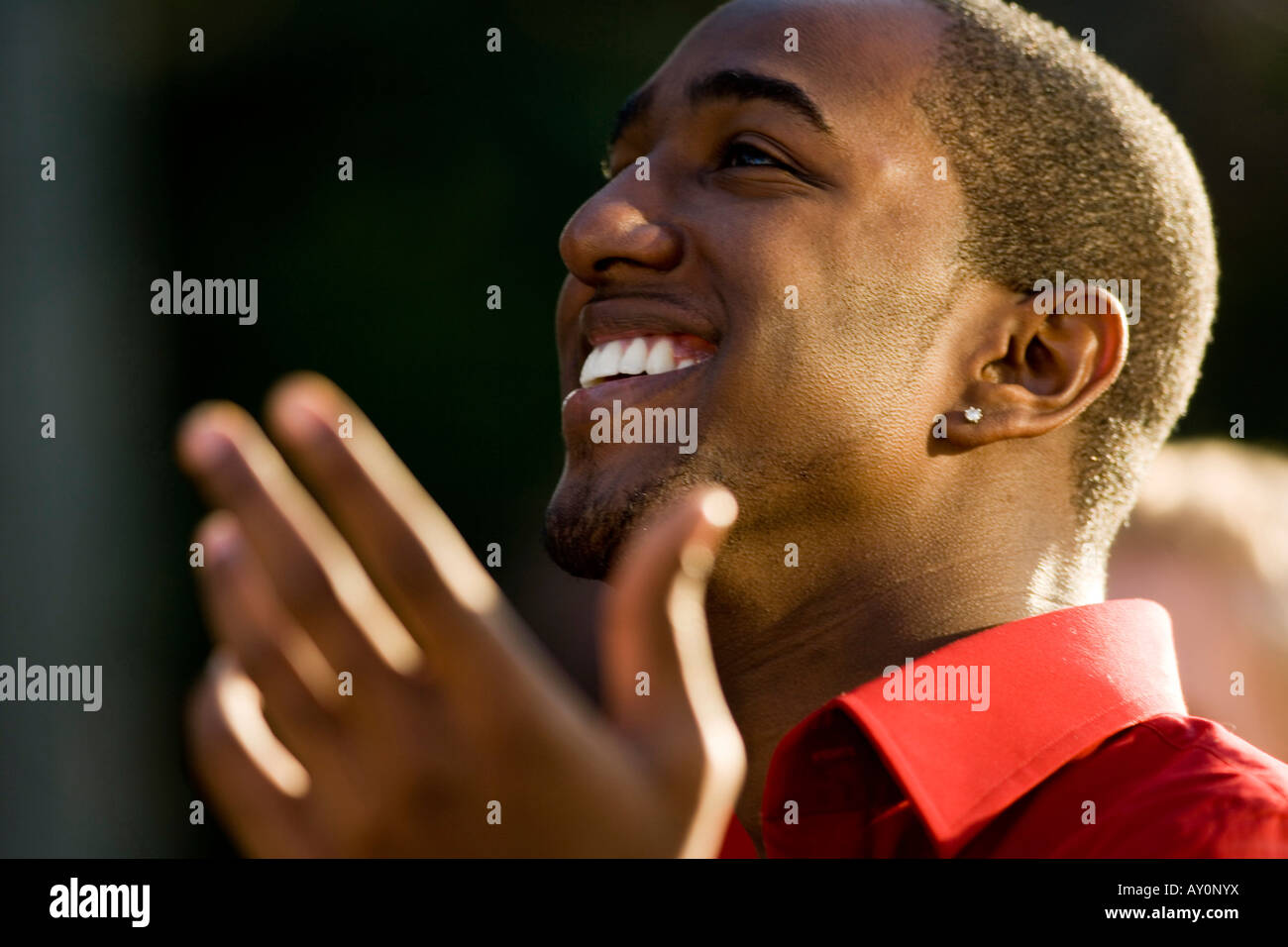 Side view of a young man smiling Stock Photo - Alamy