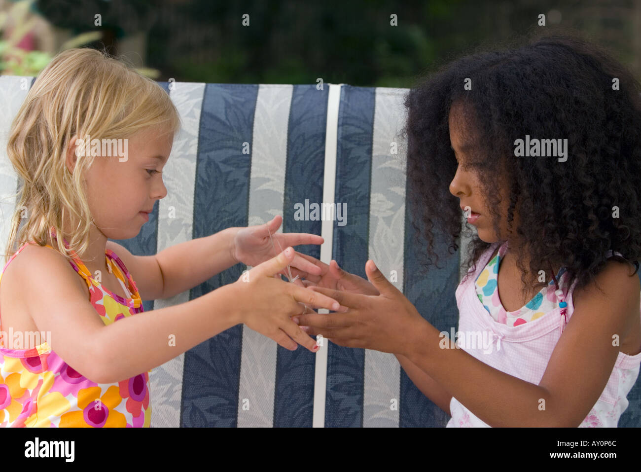 Children playing cats cradle Stock Photo - Alamy