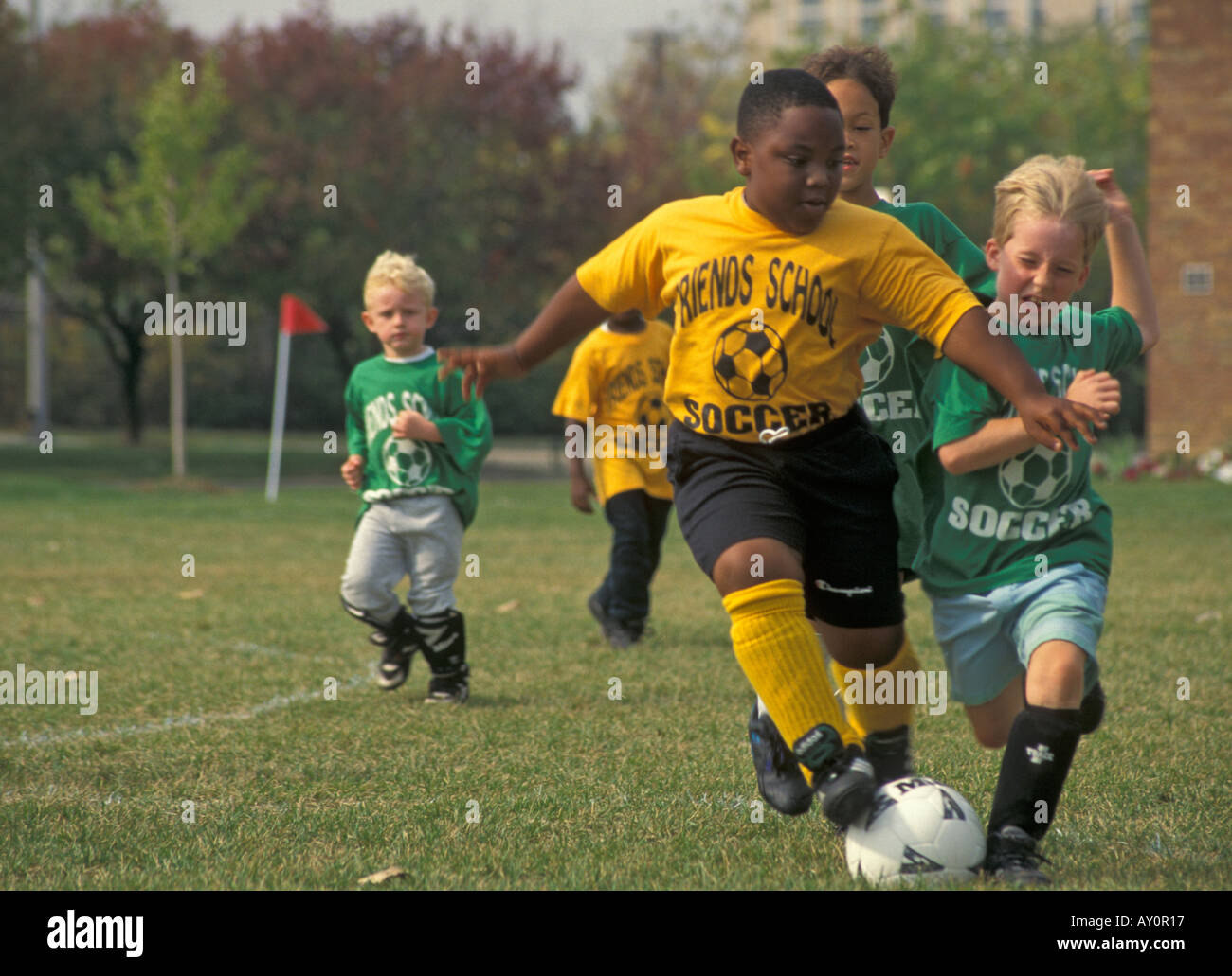 Diverse children playing football hi-res stock photography and images ...