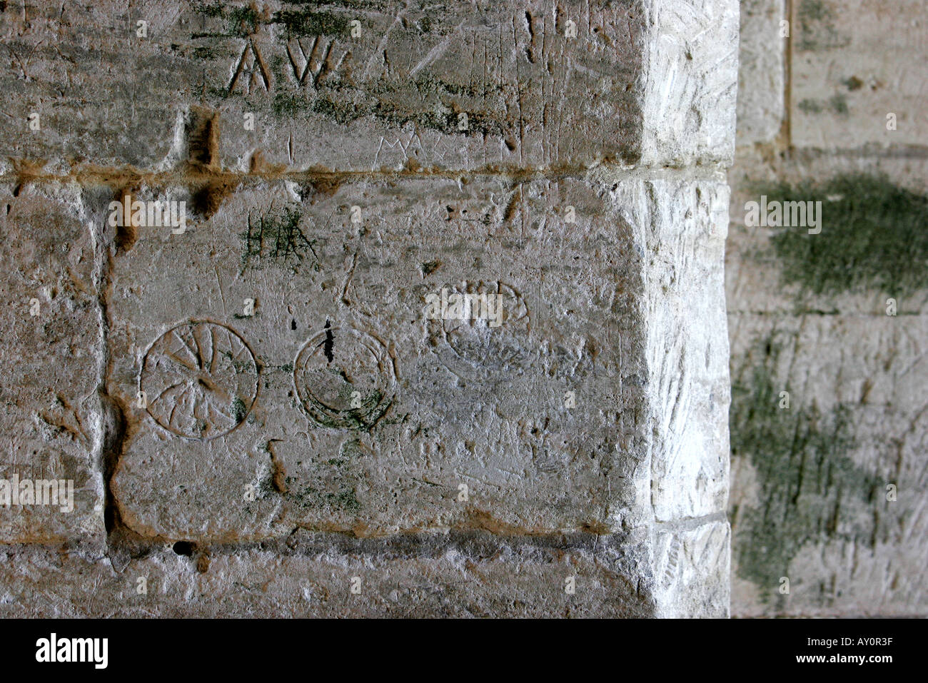 Mason's marks and good luck symbols etched in limestone blocks Stock ...