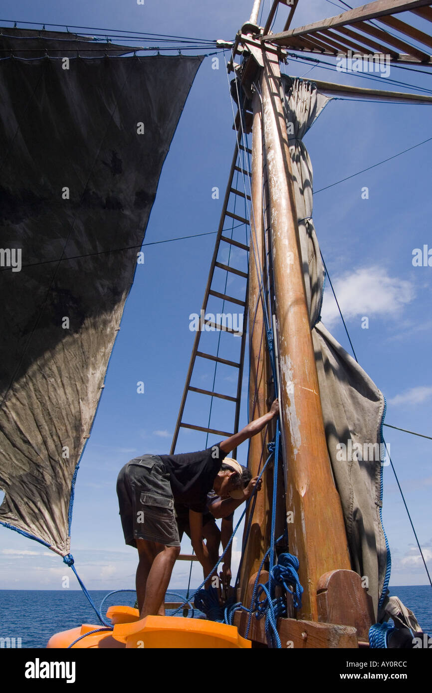 Setting the sails on a Pinisi schooner, West Papua, Indonesia Stock ...