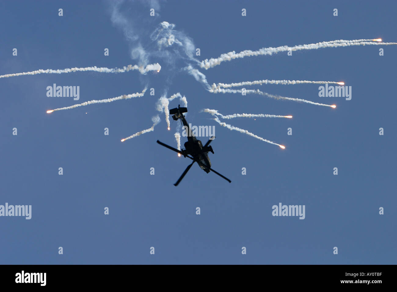 Apache AH64D helicopter performing acrobatics at an air display and ...