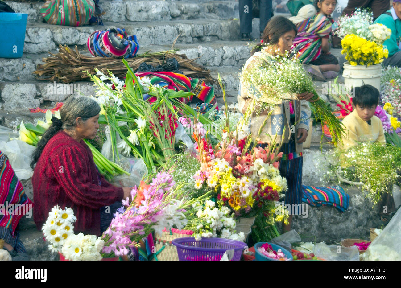 Guatemalan ladies selling flowers on the steps of the Santo Tomas ...