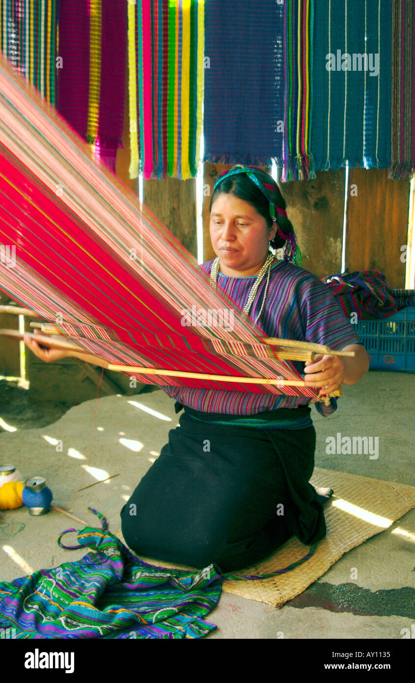 A lady weaving colorful cloth at aloom in Santa Catarina Palopo ...