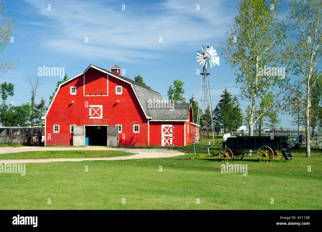 A red barn and windmill at the Mennonite Heritage Village in Steinbach ...