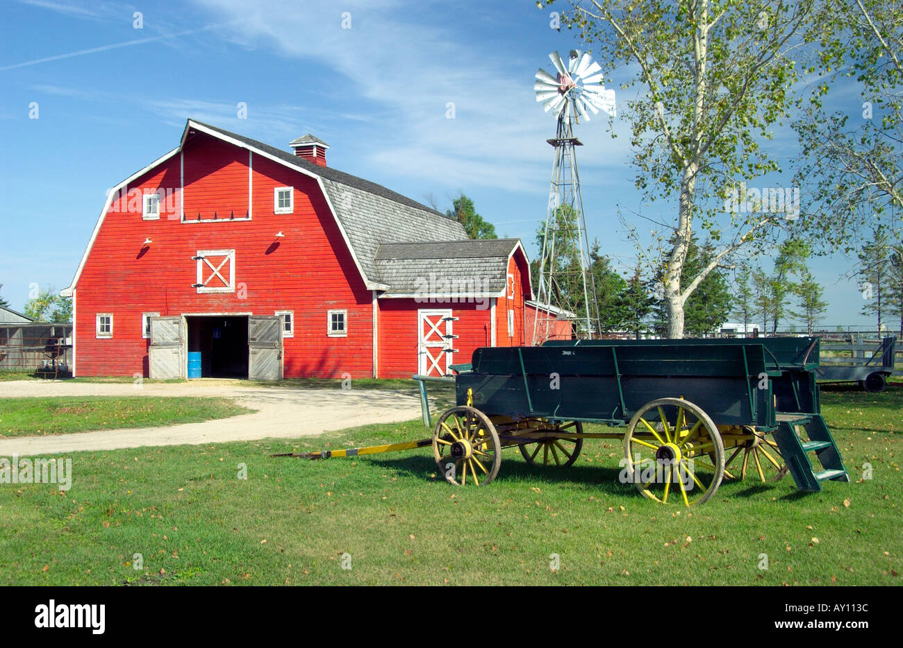 A red barn and windmill at the Mennonite Heritage Museum in Steinbach ...