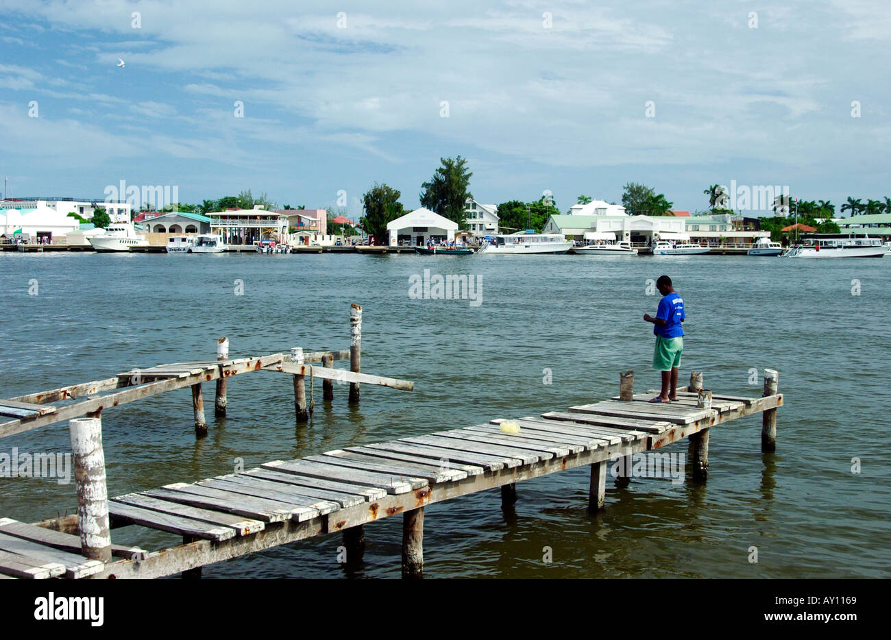 A young Belizean boy on a dock in Belize City Belize Central America ...