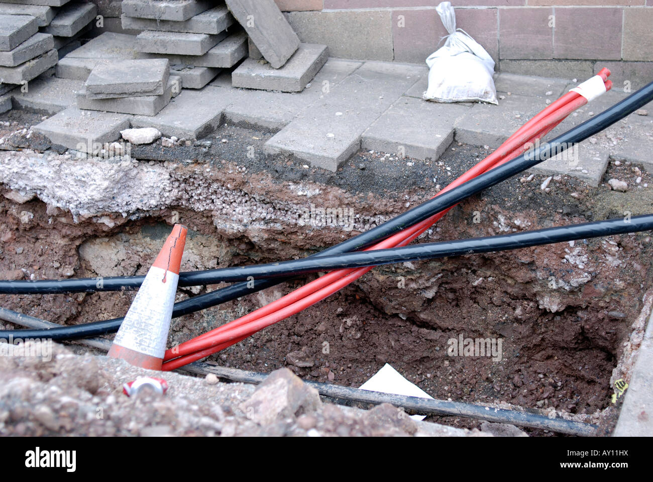 Underground infrastructure being laid in a hole in the ground in a ...