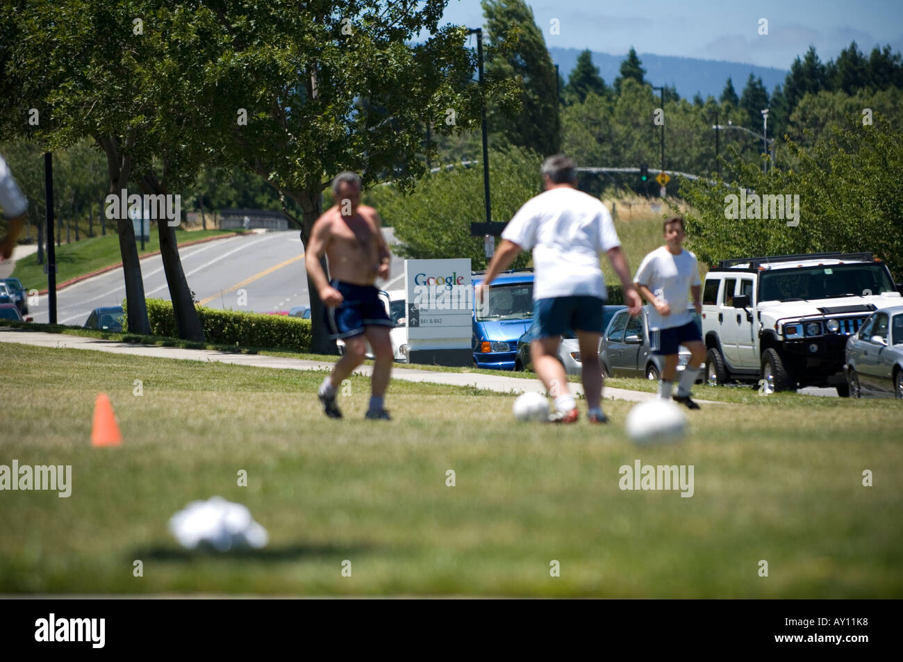 Google employees playing soccer match outside Google headquarters ...