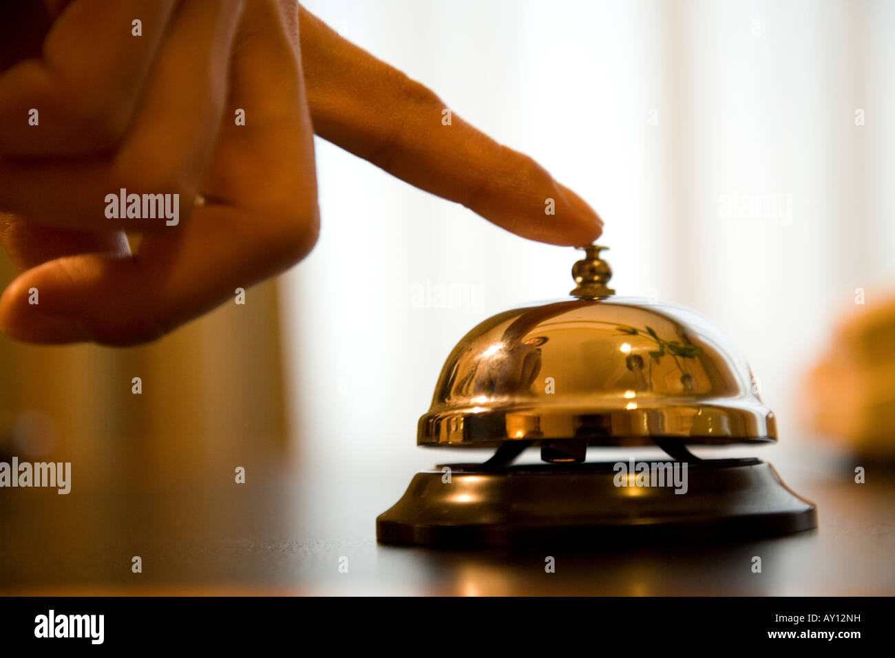 Man ringing service bell Stock Photo - Alamy