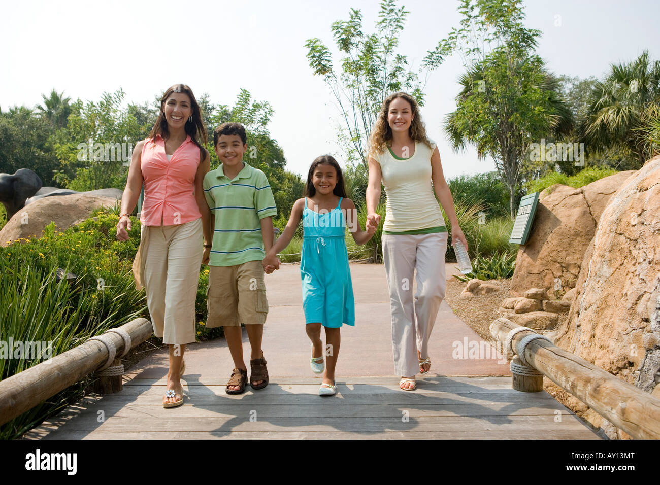 Portrait of people walking together on board walk Stock Photo - Alamy
