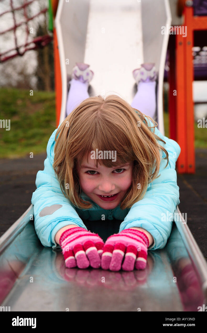 Child on slide hi-res stock photography and images - Alamy