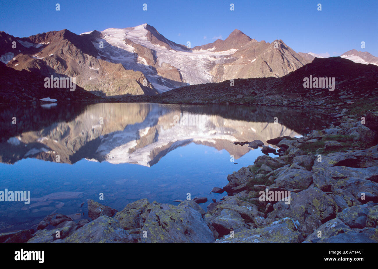 The Wilder Freiger reflected in an alpine tarn, Stubai Alps, Tirol ...