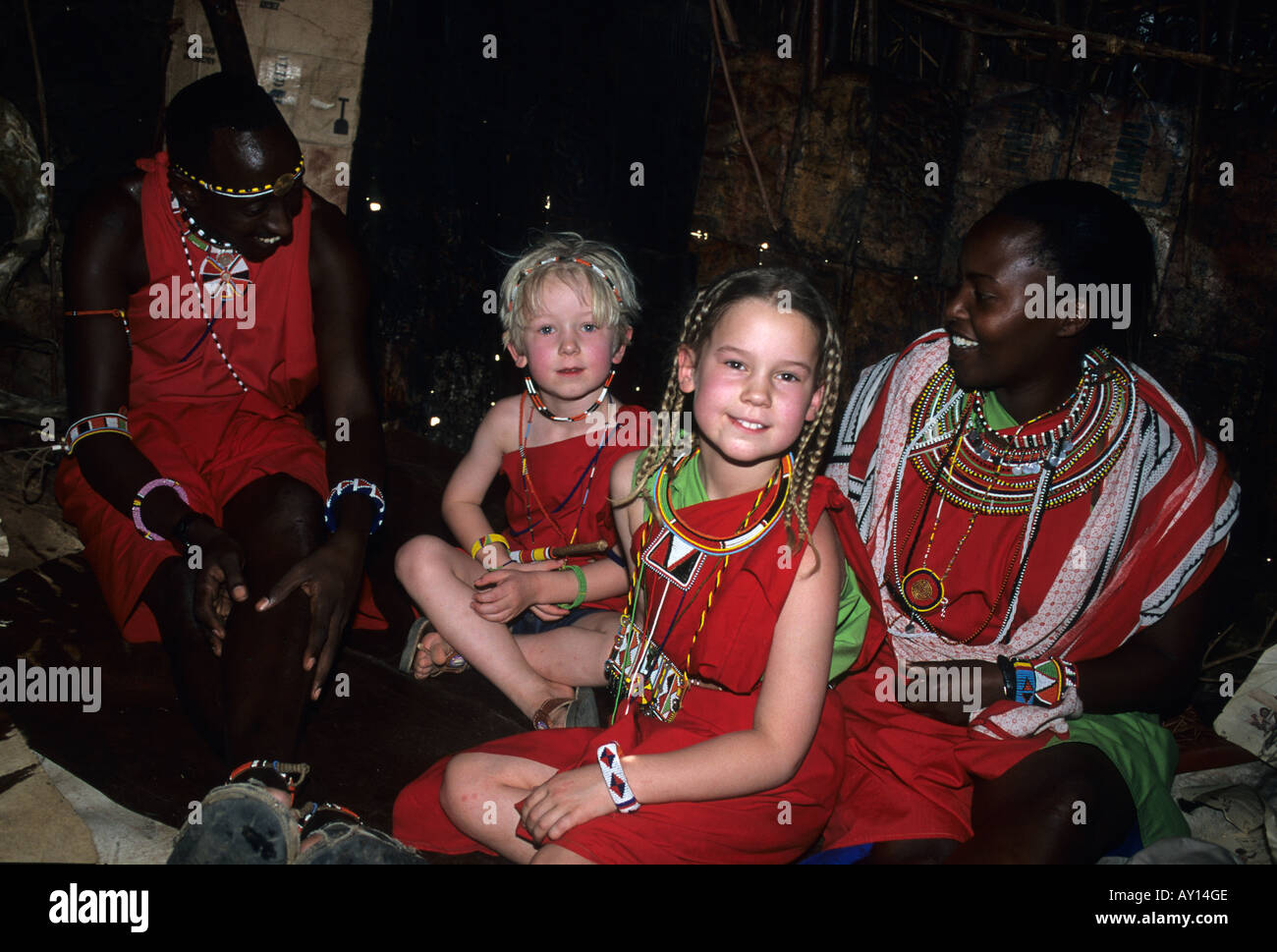 Western boy and girl in traditional Samburu/Masai dress and jewellery ...