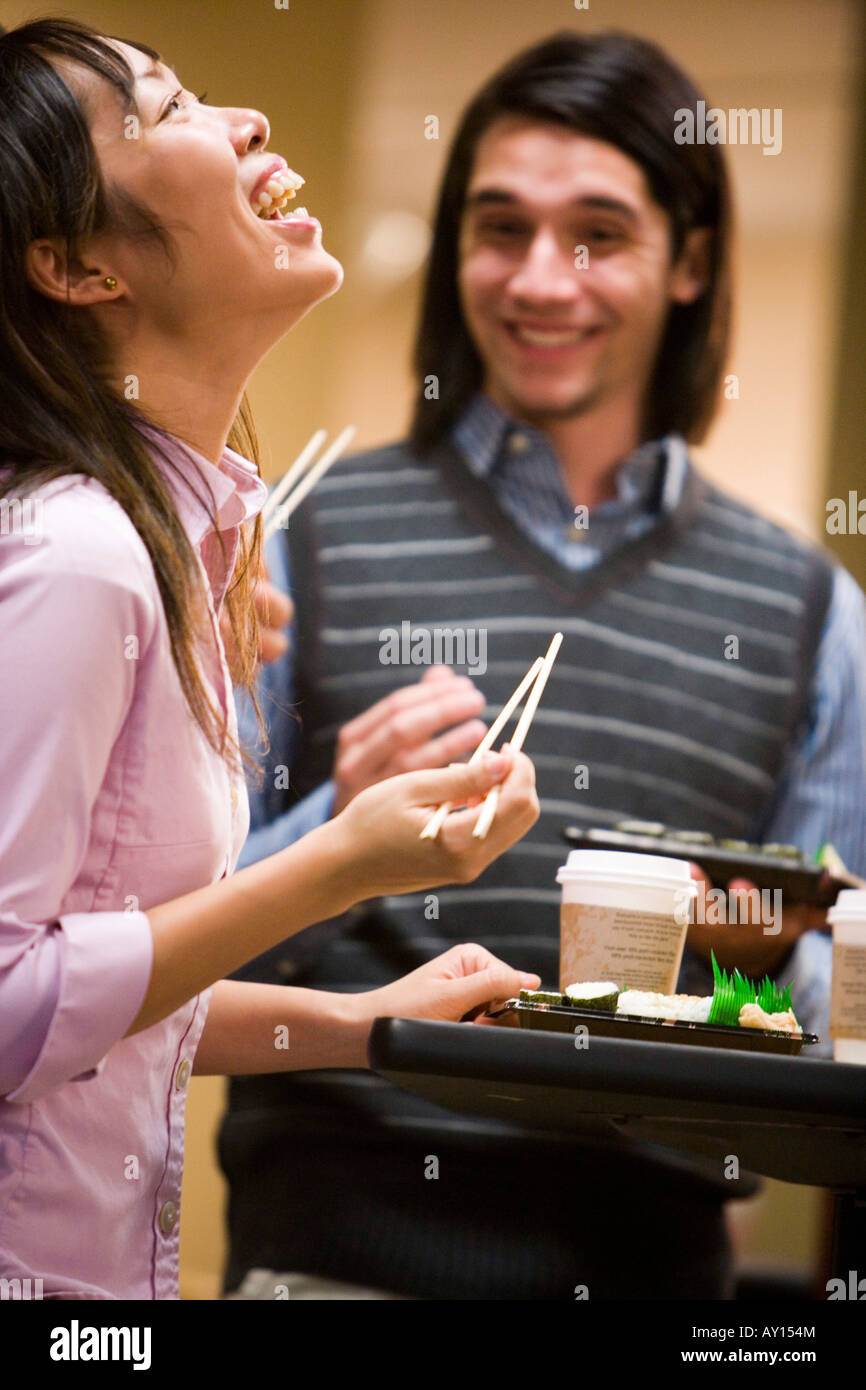 People standing and eating food Stock Photo - Alamy