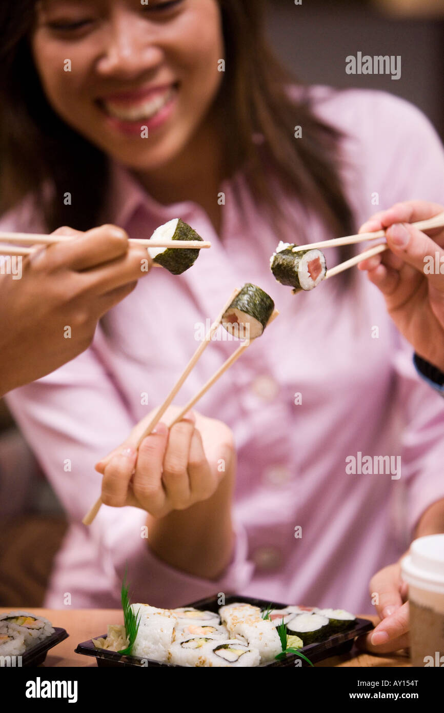 People sitting and eating food Stock Photo - Alamy